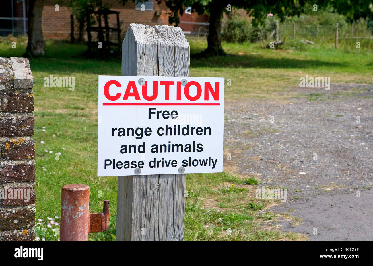 Funny warning sign in Sussex village, England, UK Stock Photo - Alamy