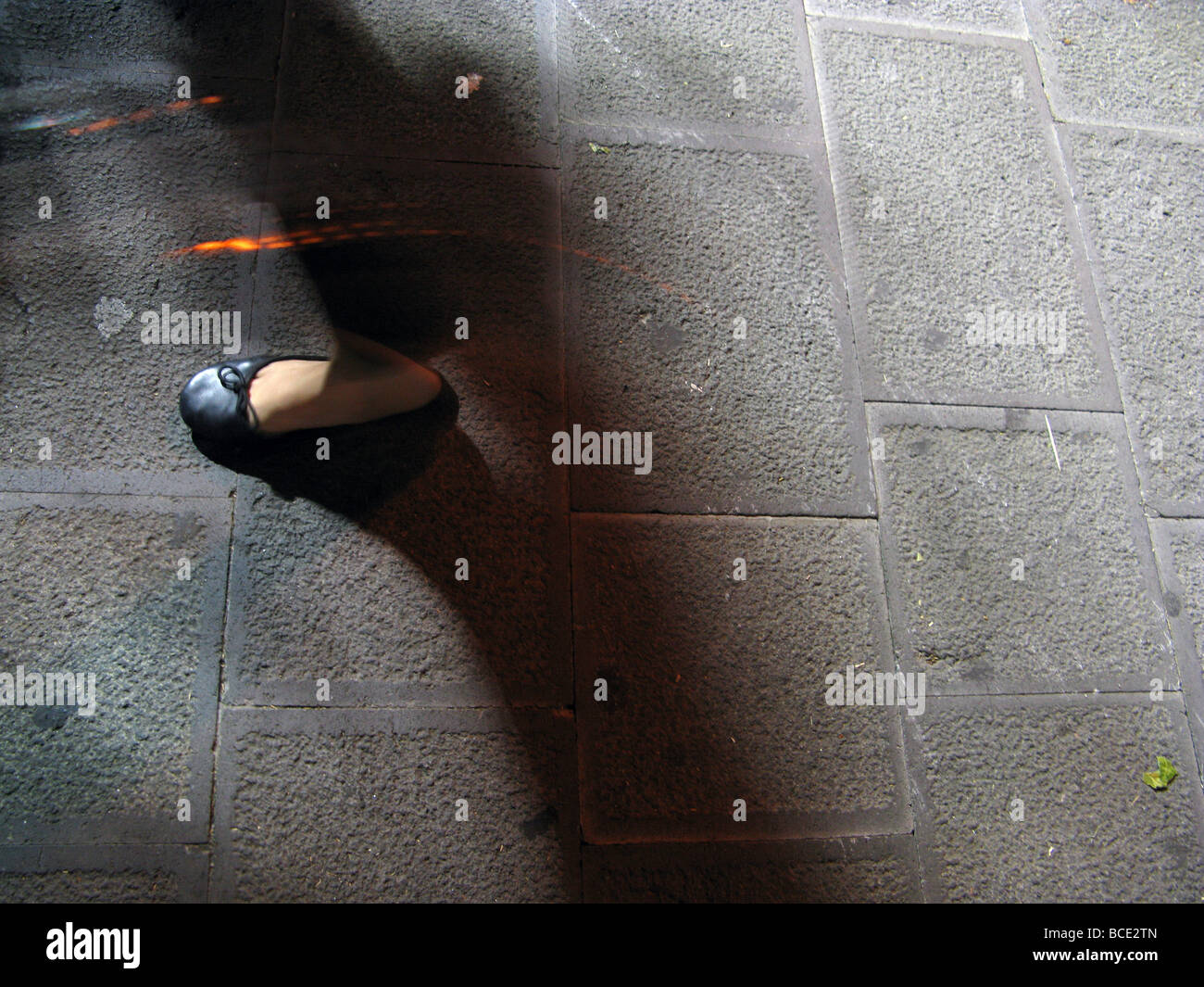 one person walking in street in city town Stock Photo - Alamy
