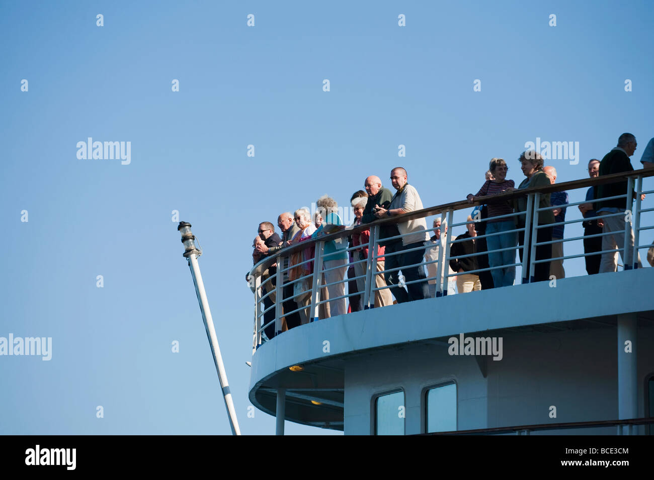 Passengers on stern at a cruise ship Stock Photo - Alamy