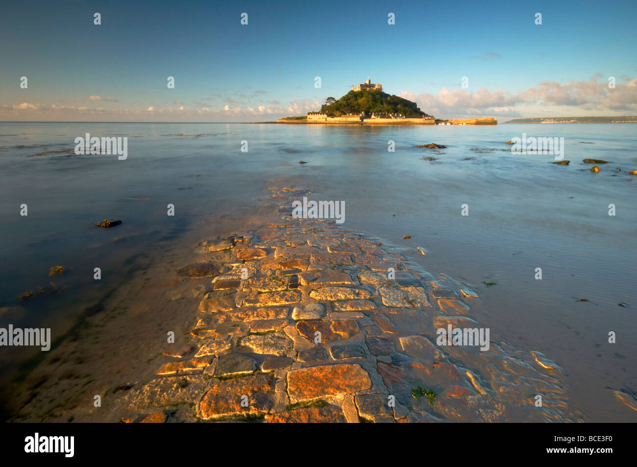 The old stone causeway leading to St Michaels Mount at dawn at low tide ...