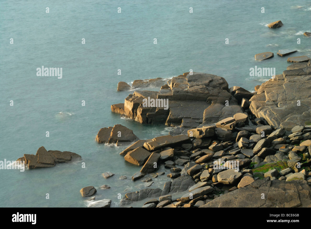 Exposed bedrock at a beach in the Valley of the Rocks South West ...