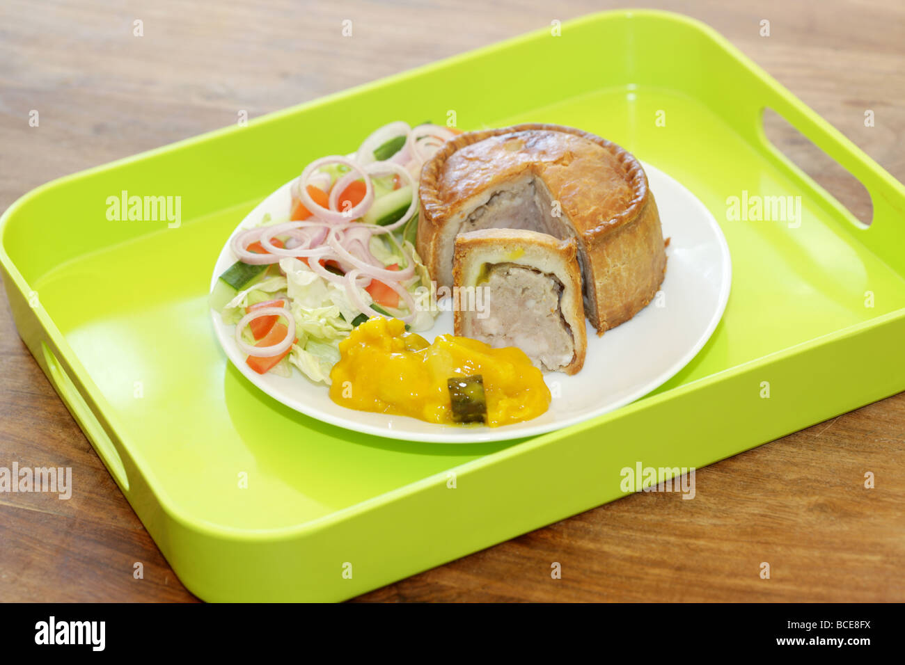 Fresh Tasty Traditional Pork Pie With A Mixed Salad And Yellow Piccalilli Pickles Meal With No ...