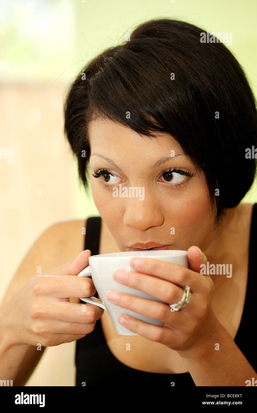 Young Woman Drinking Tea Model Released Stock Photo - Alamy