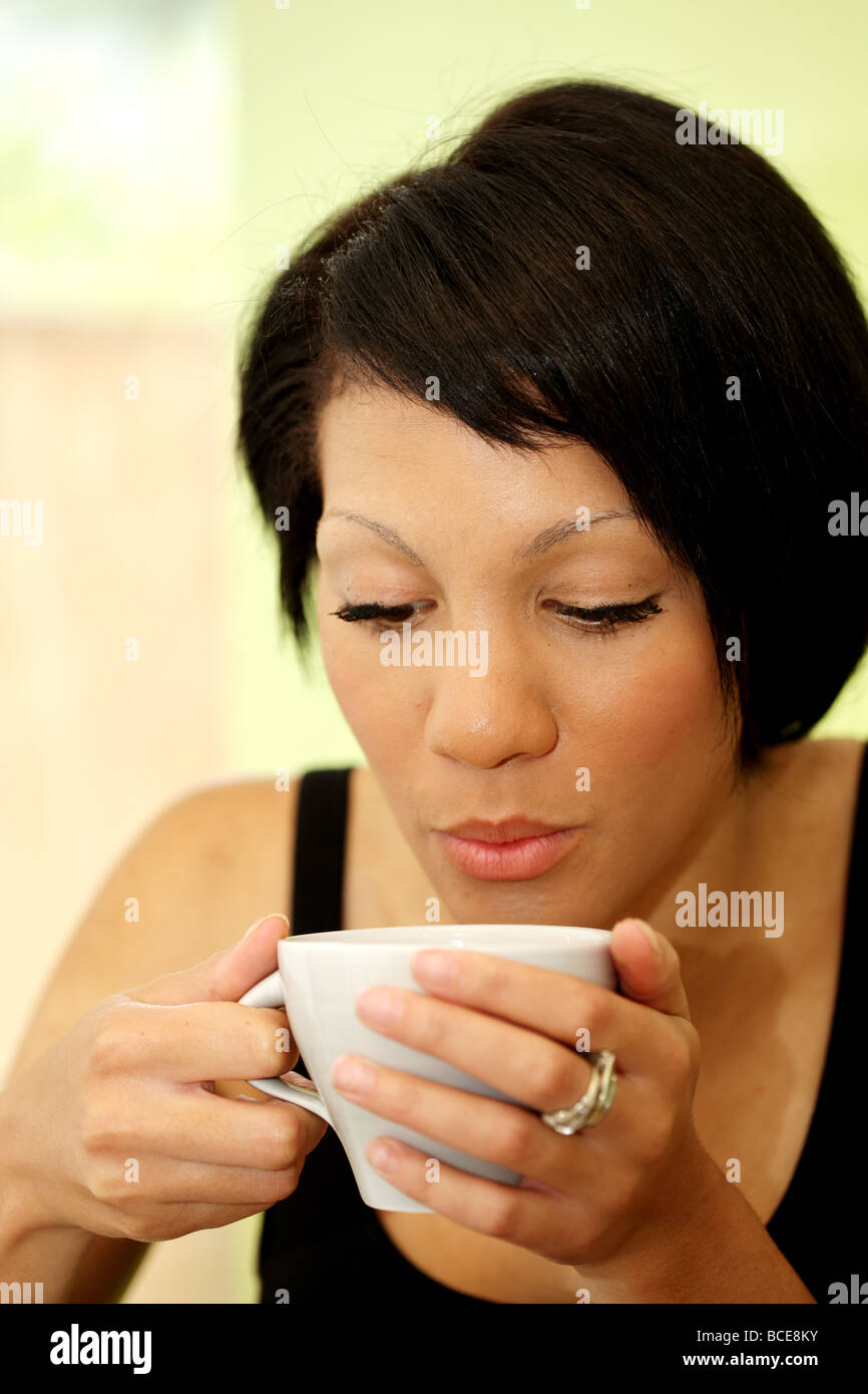 Young Woman Drinking Tea Model Released Stock Photo - Alamy
