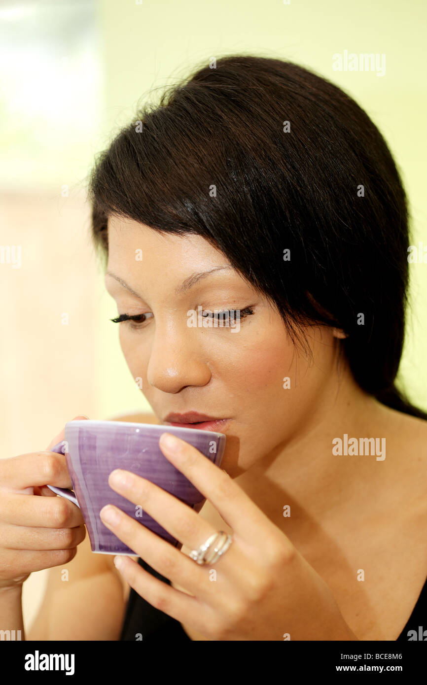 Young Woman Drinking Tea Model Released Stock Photo - Alamy