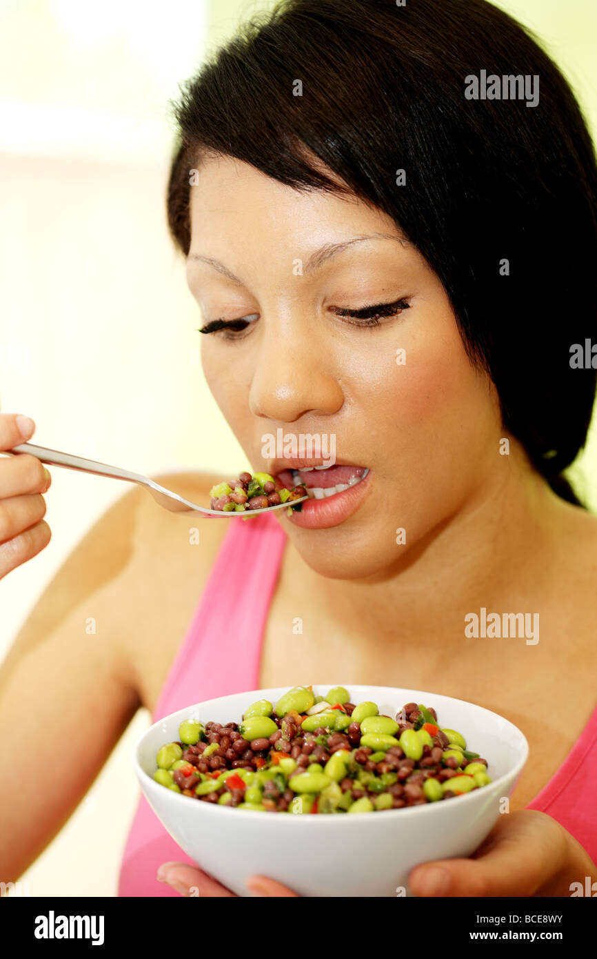 Young Woman Eating Adzuki And Edamame Bean Salad Model Released Stock ...