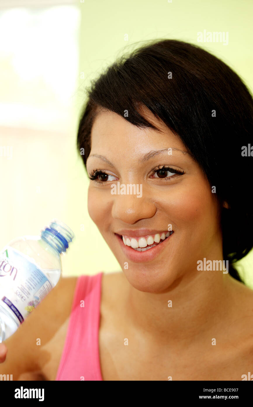 Young Woman Drinking Mineral Water Model Released Stock Photo - Alamy