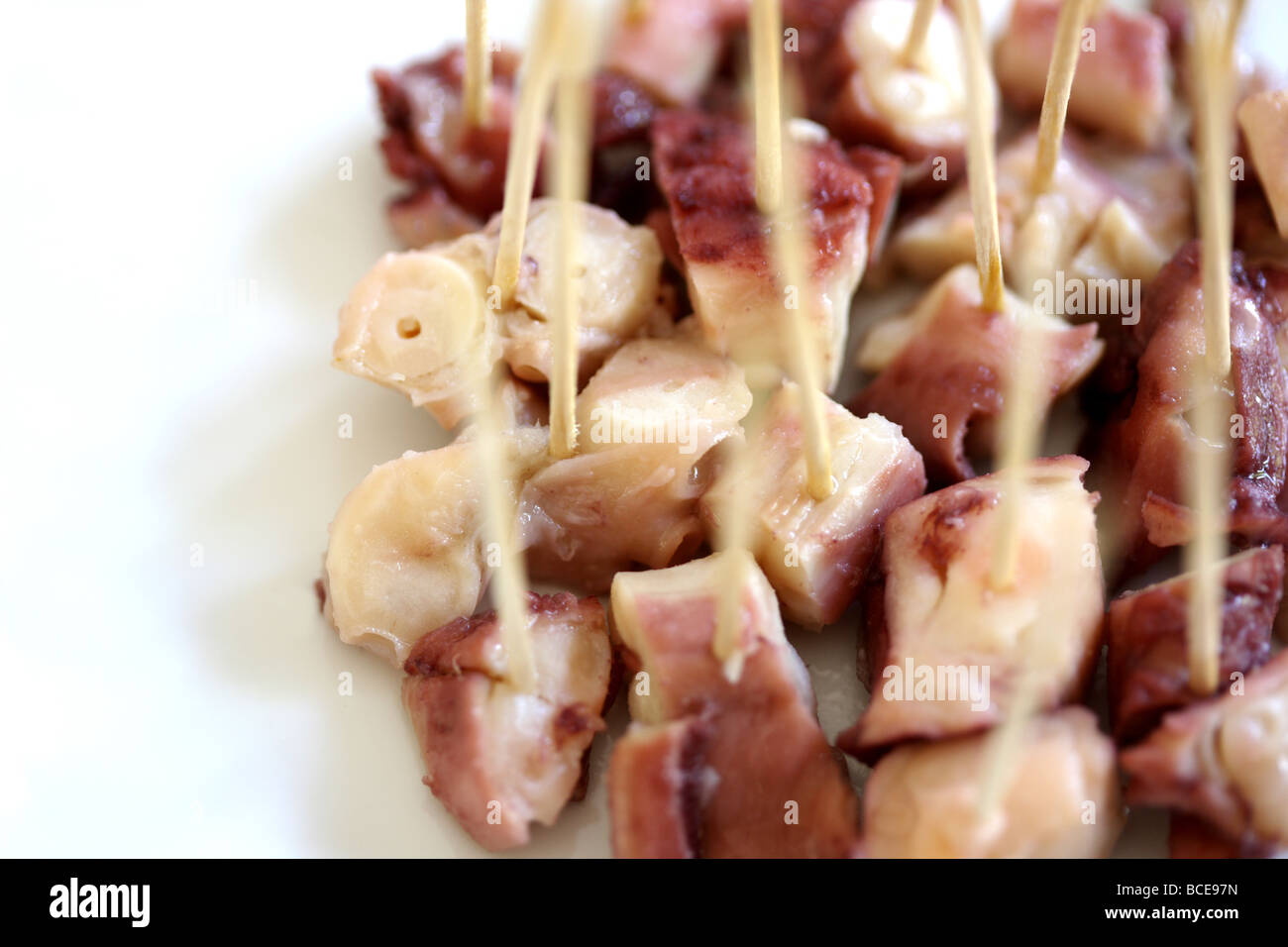 Octopus Chunks on Cocktail Sticks Stock Photo - Alamy