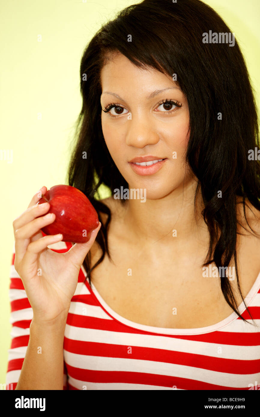 Healthy Young Woman Eating An Apple Model Released Stock Photo - Alamy