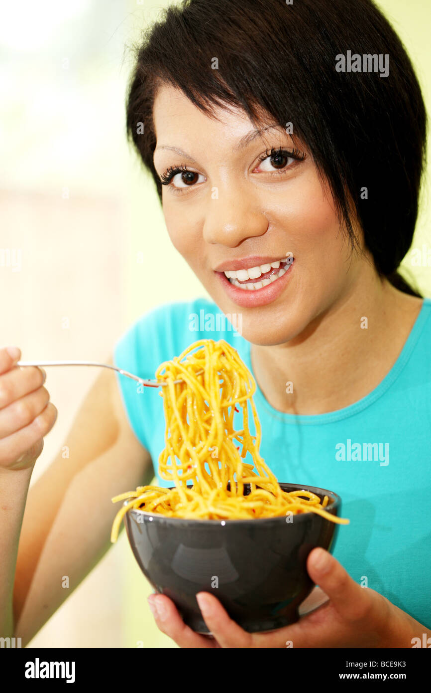 Young Woman Eating Noodles Model Released Stock Photo - Alamy