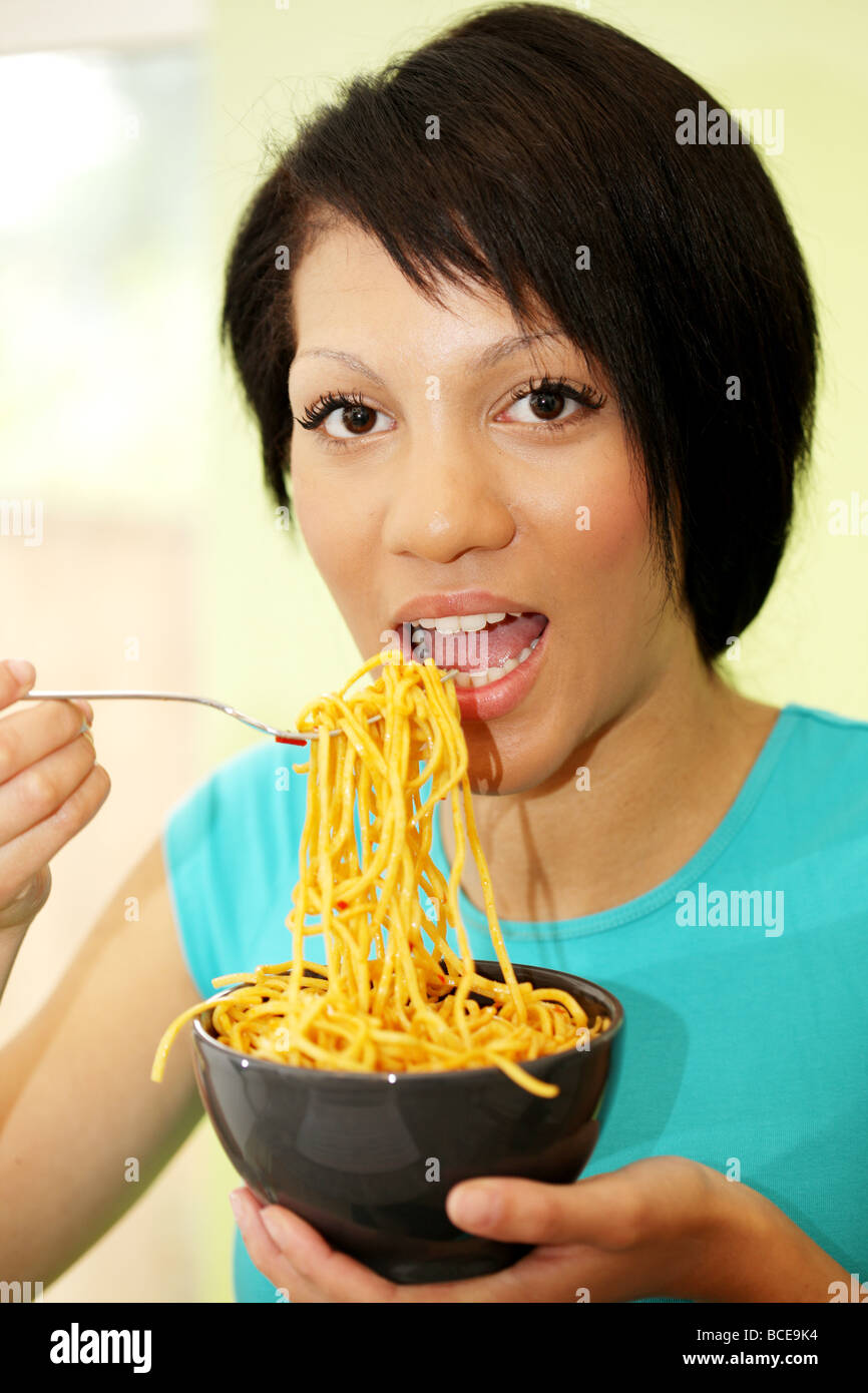 Young Woman Eating Noodles Model Released Stock Photo - Alamy