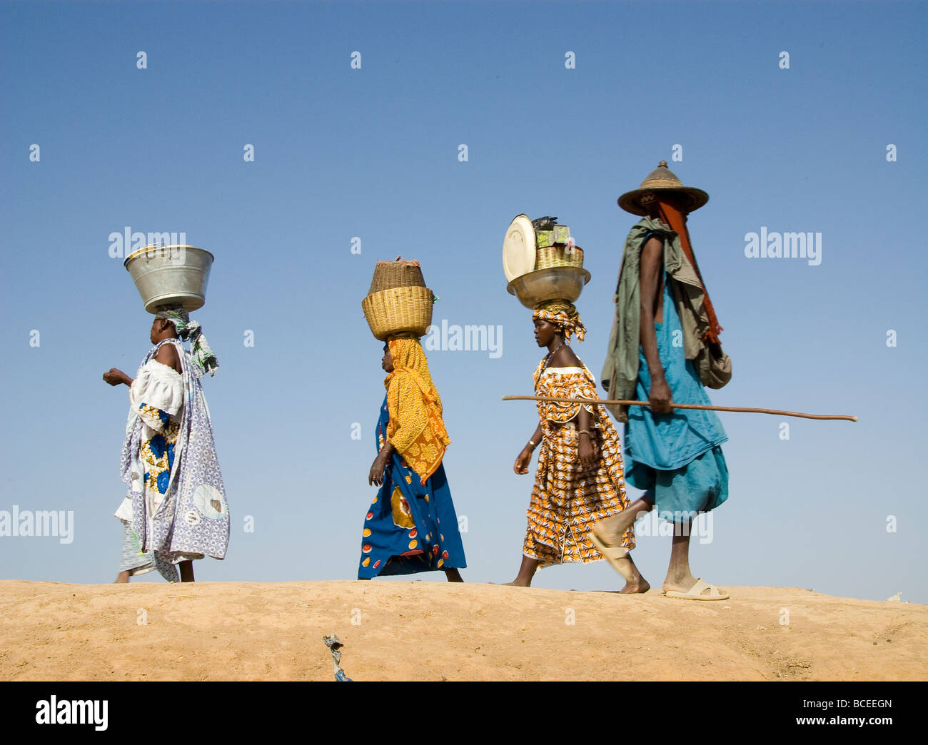 Mali. Sahel. Mens and womens of Djenne. Returning from the market Stock ...