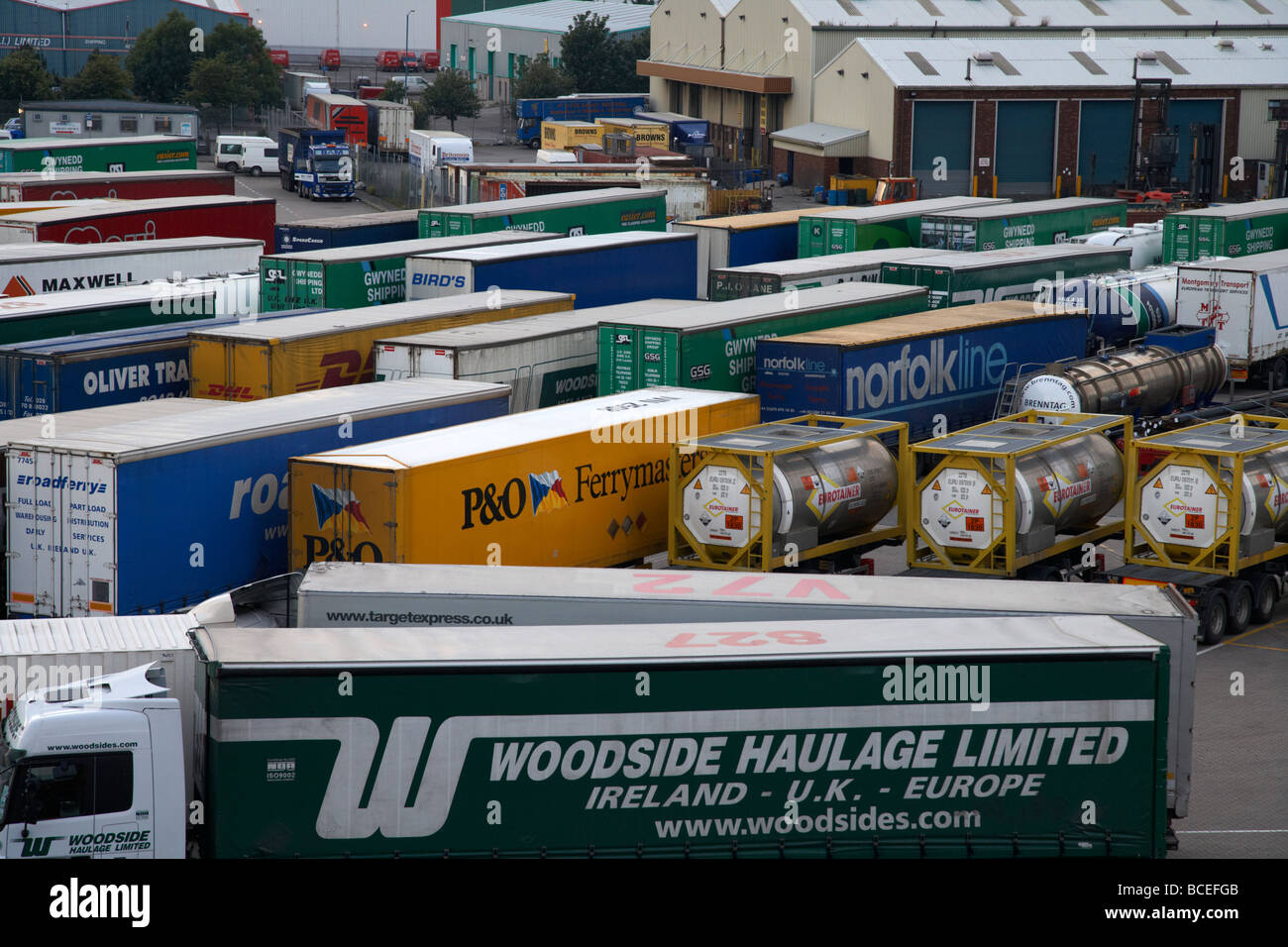 containers loaded onto lorry trailers for onward transport in the port ...