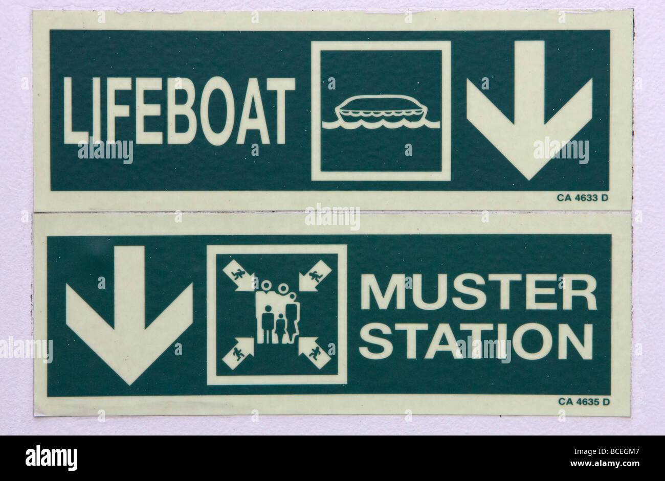 luminous lifeboat and muster station signs on board a car ferry in the ...