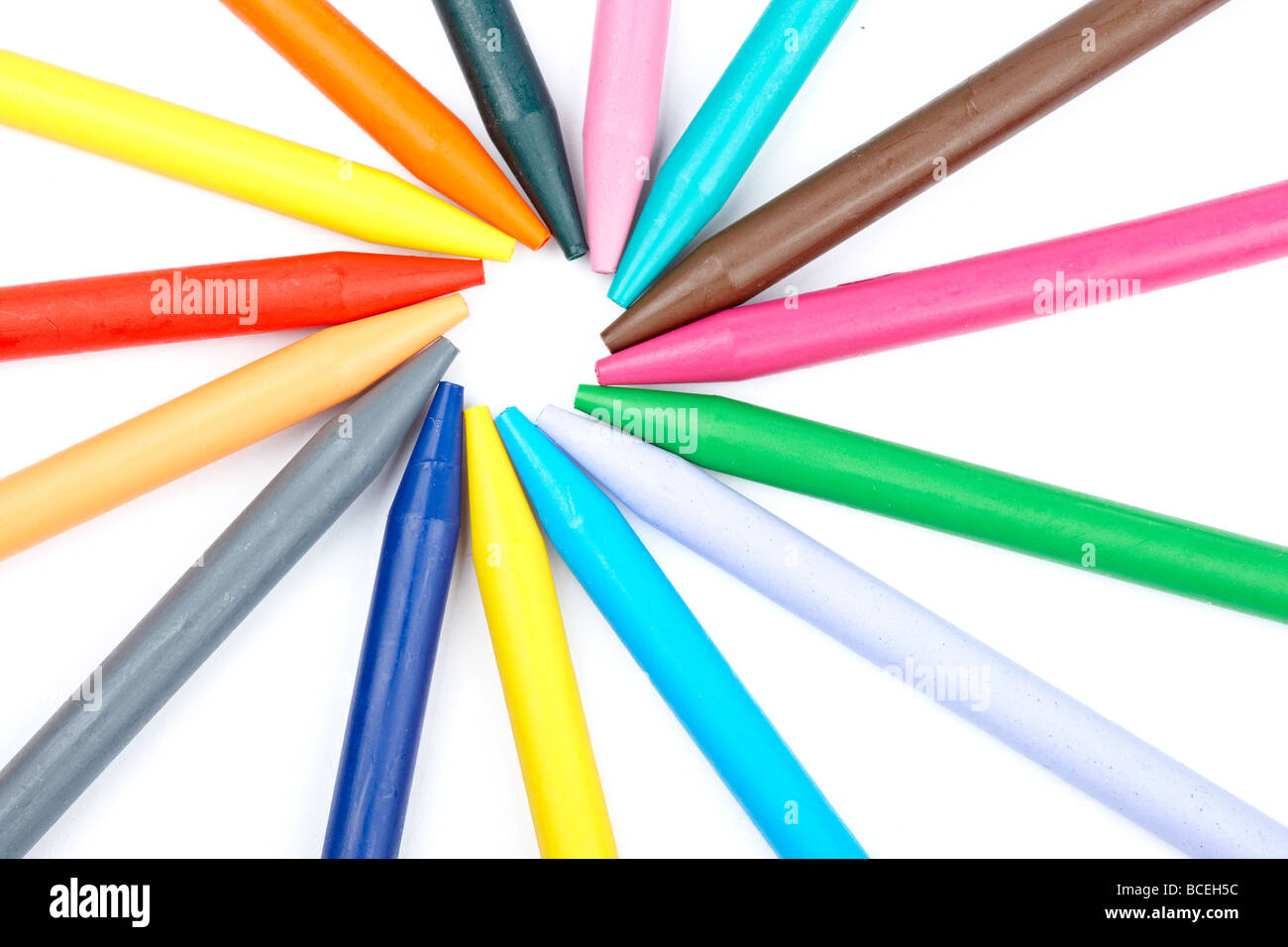 Assortment of coloured wax crayons isolated on white background Path ...