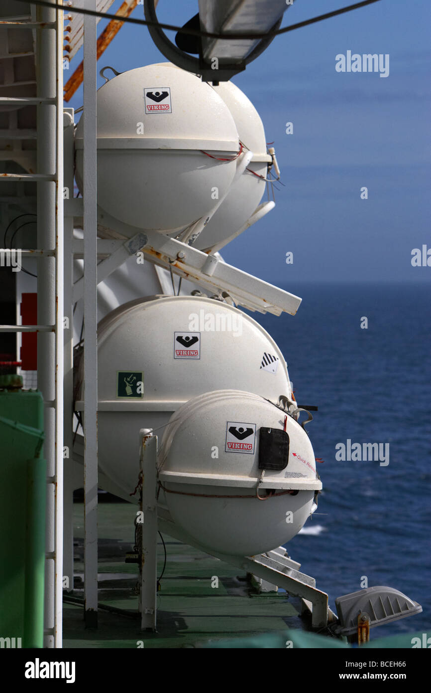 liferafts and life saving equipment at a muster station on the side of ...