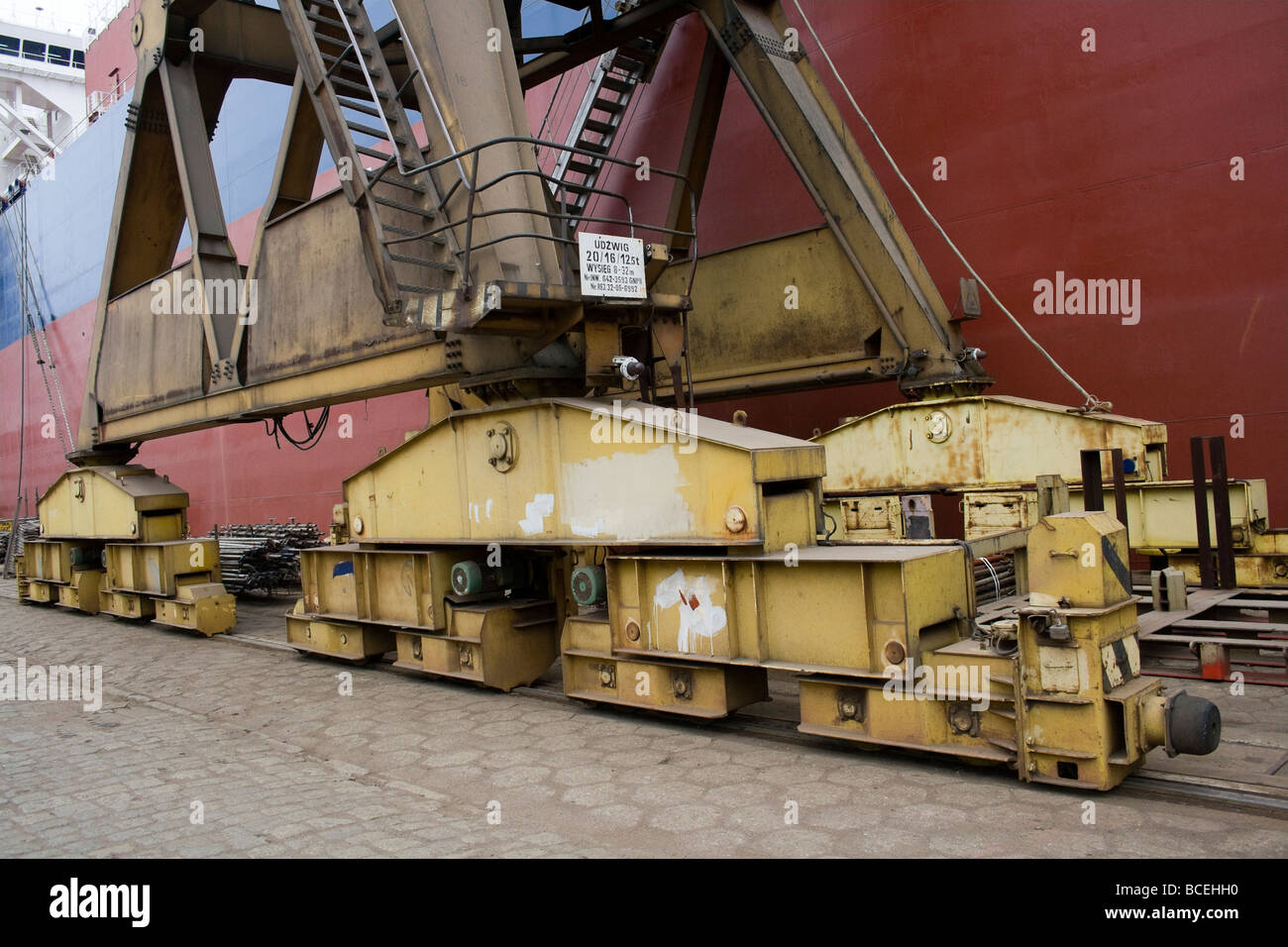 Detail of shipyards crane stand, which is moving on steel rails across ...