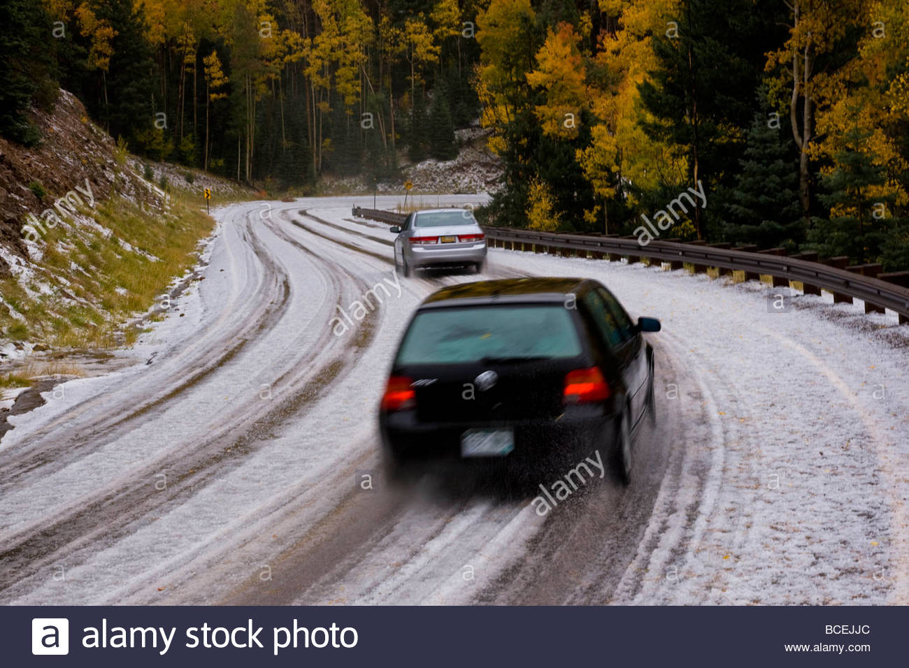 Two cars drive on an icy highway in New Mexico Stock Photo - Alamy
