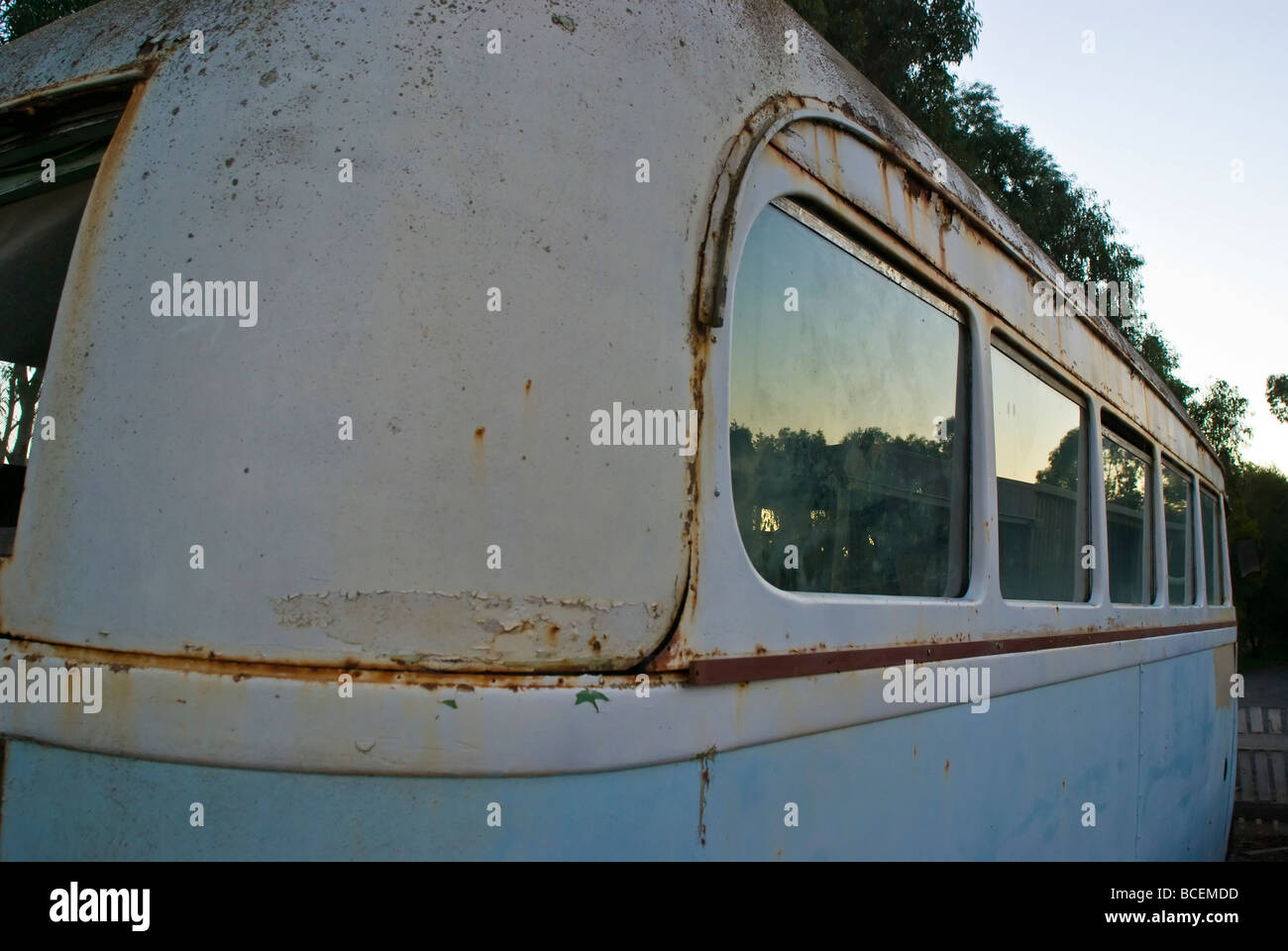 Rust eating away at the classic lines of an antique bus on a farm Stock ...