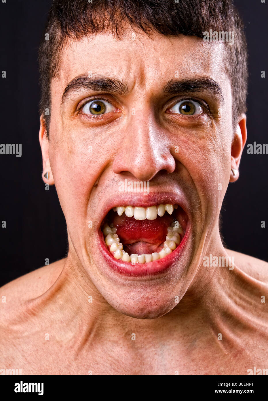 Scream of shocked and scared young man Stock Photo - Alamy