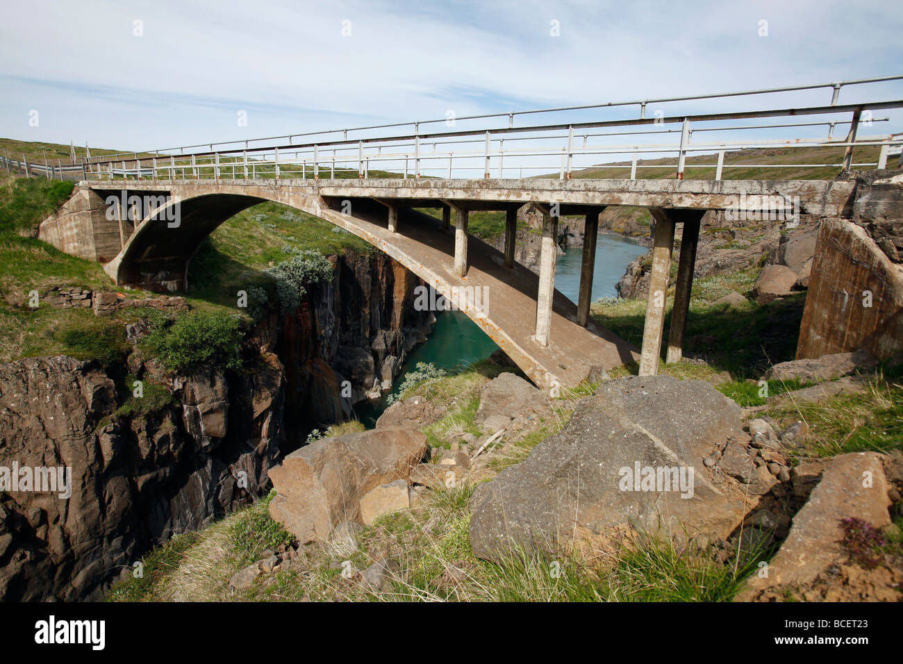 An abandoned concrete arch bridge over a gorge in northeast Iceland ...