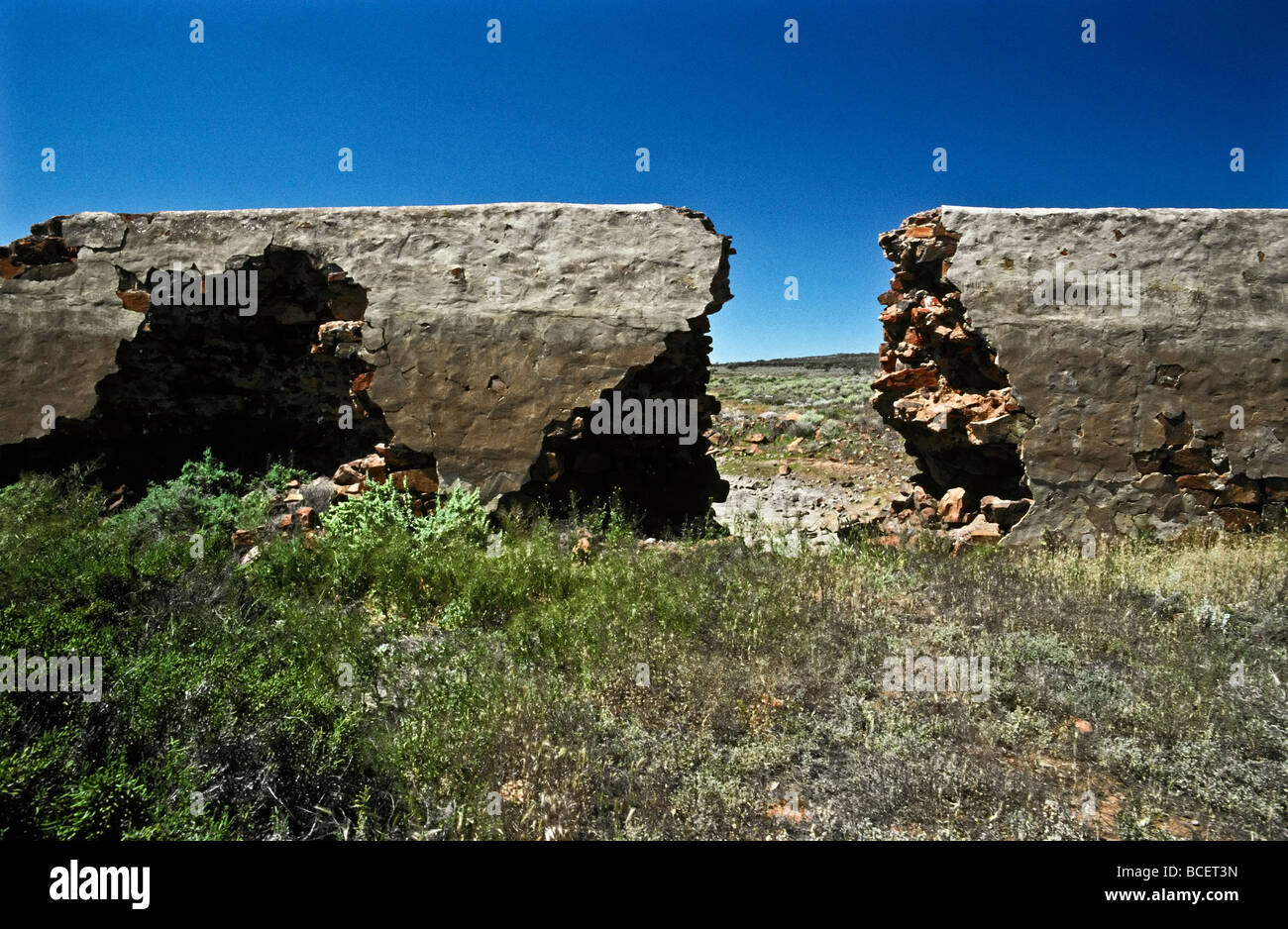 Desert floodwaters demolish a hole in a nineteenth century dam wall ...