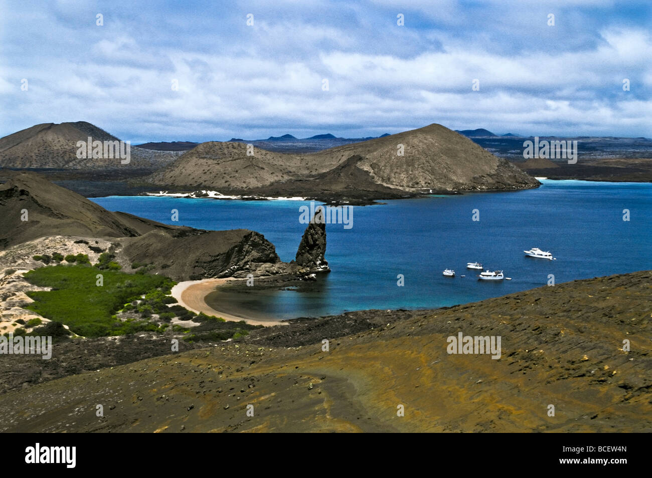 Ancient lava flows and extinct volcano cones rise from turquoise seas ...