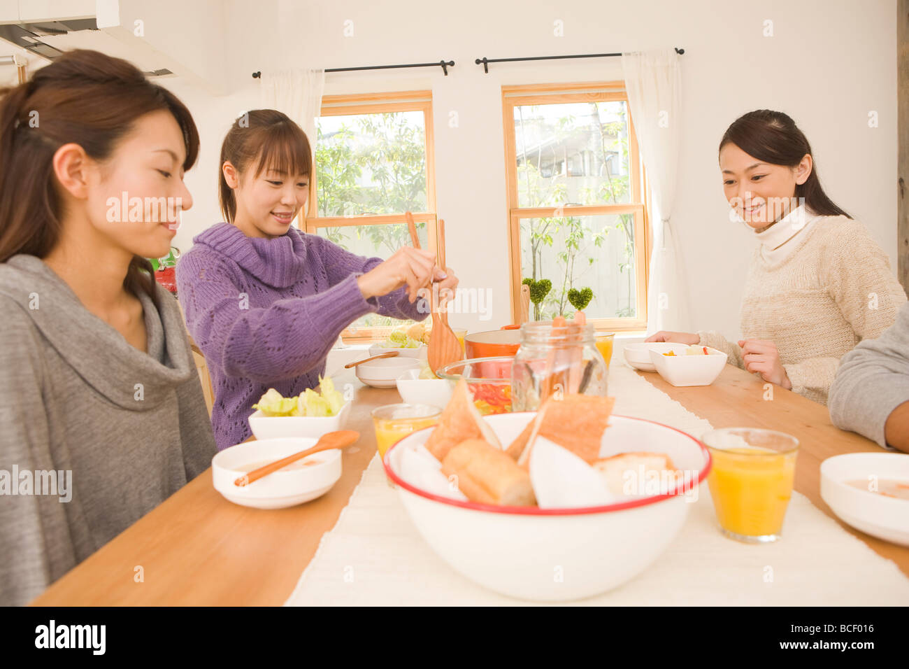 Young women having home party Stock Photo - Alamy
