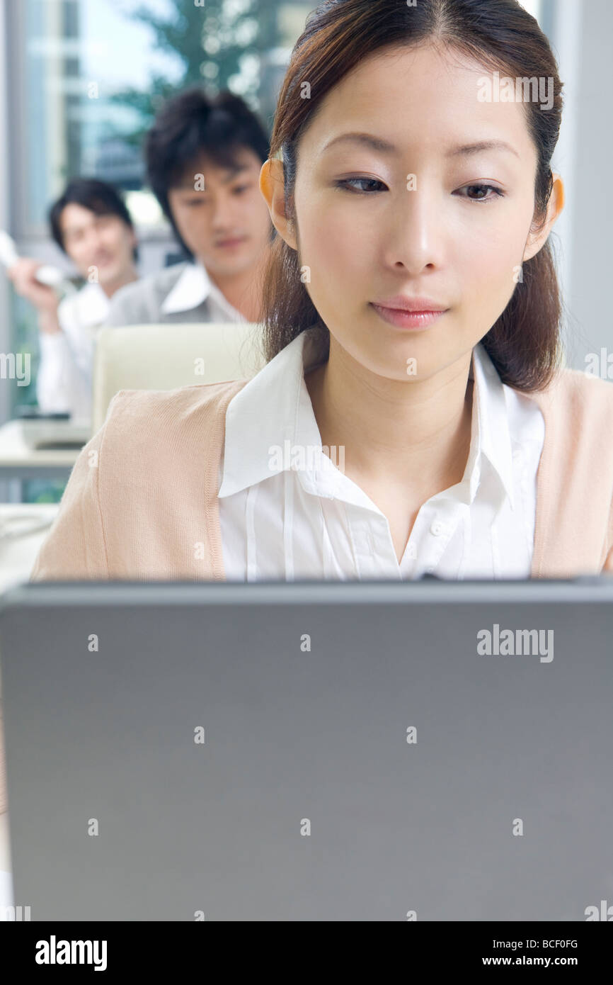 Three people working in office Stock Photo - Alamy