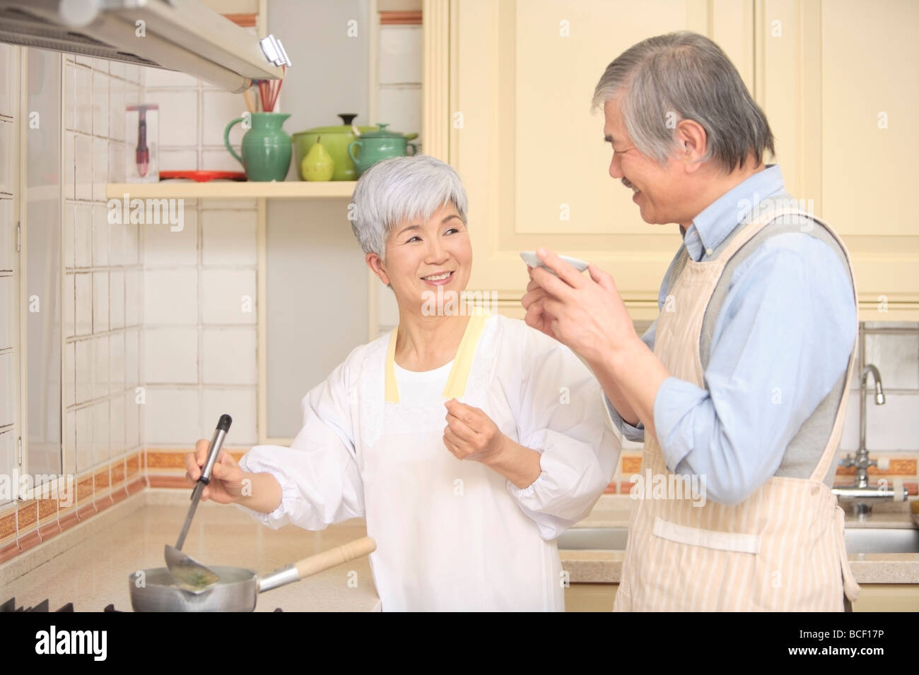 Senior couple cooking Stock Photo - Alamy