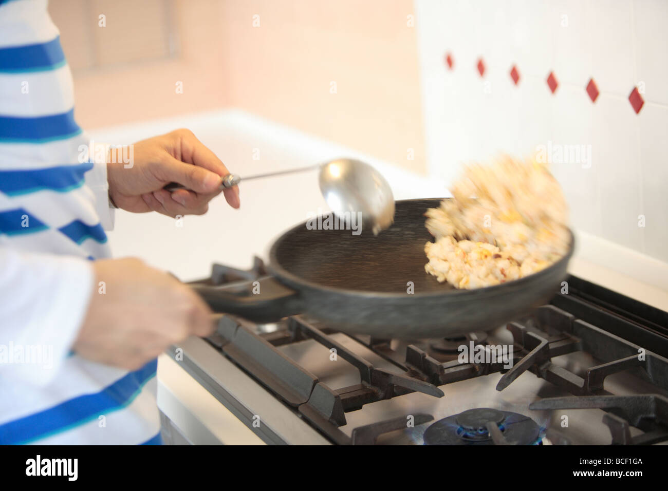 Human Hand cooking Stock Photo - Alamy