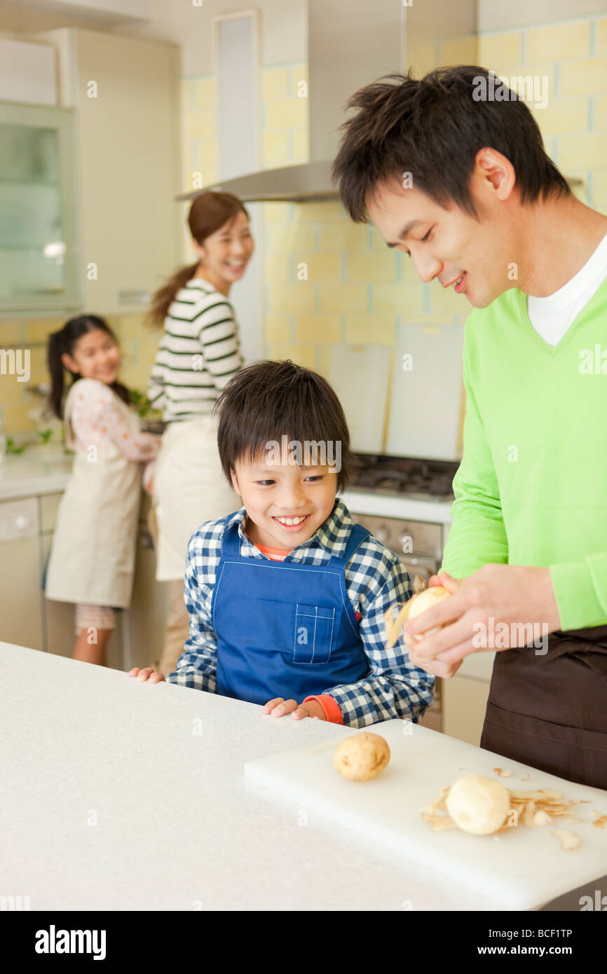 Parents and children cooking Stock Photo - Alamy
