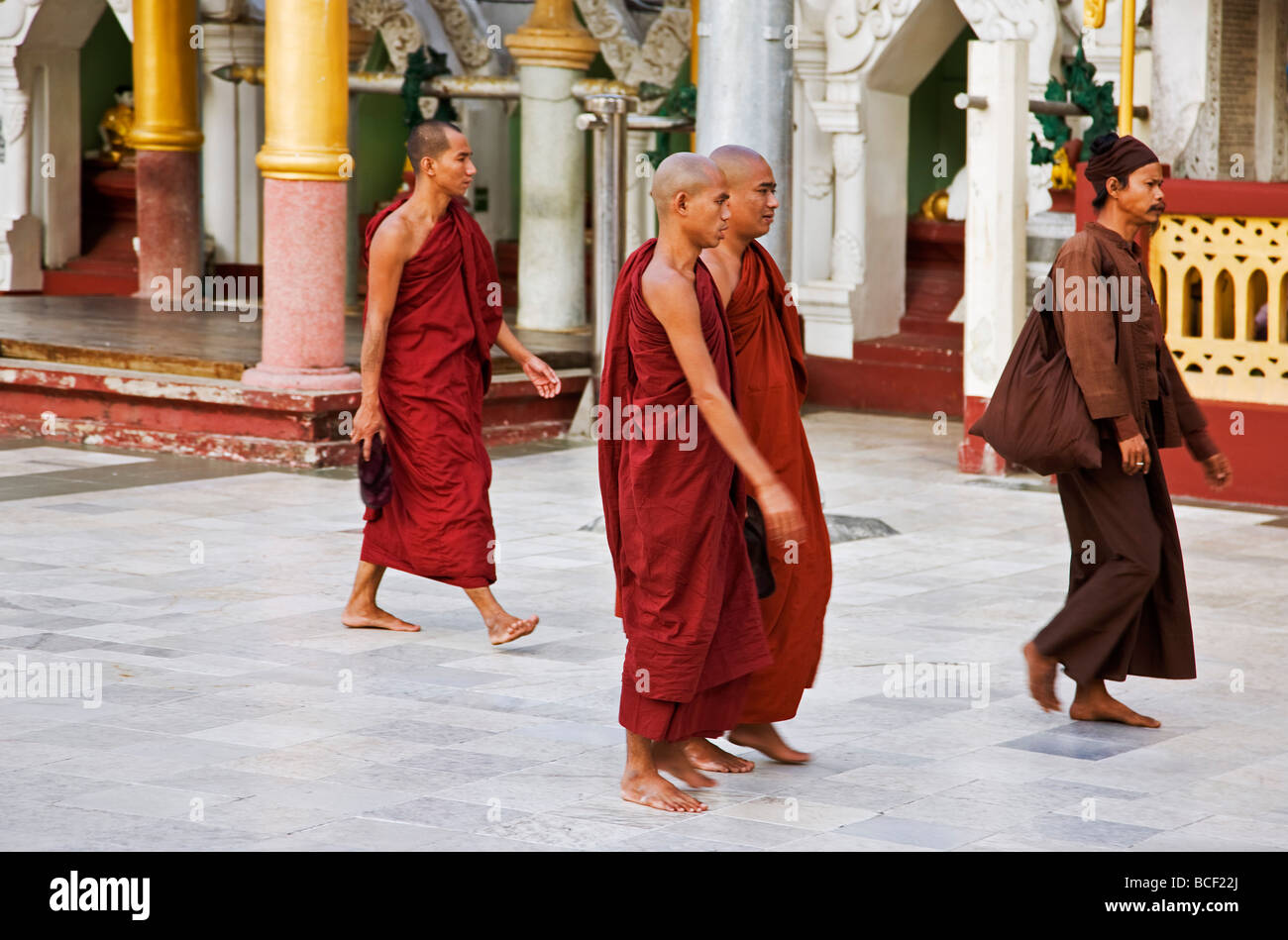 Myanmar, Burma, Yangon. Buddhist monks at the 2,540-year-old Shwedagon ...