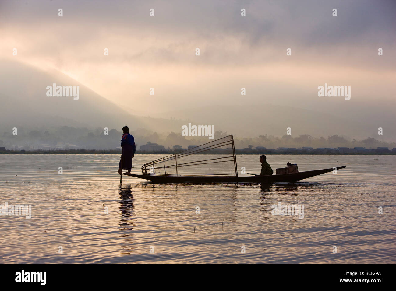 Myanmar, Burma, Lake Inle. An Intha fisherman with traditional fish ...
