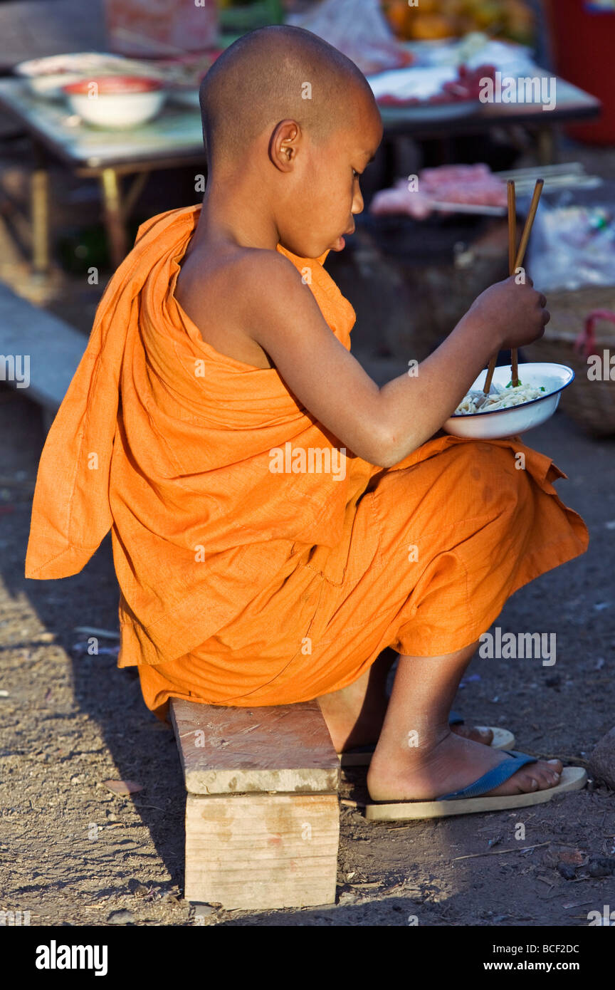 Novice monk eating hi-res stock photography and images - Alamy
