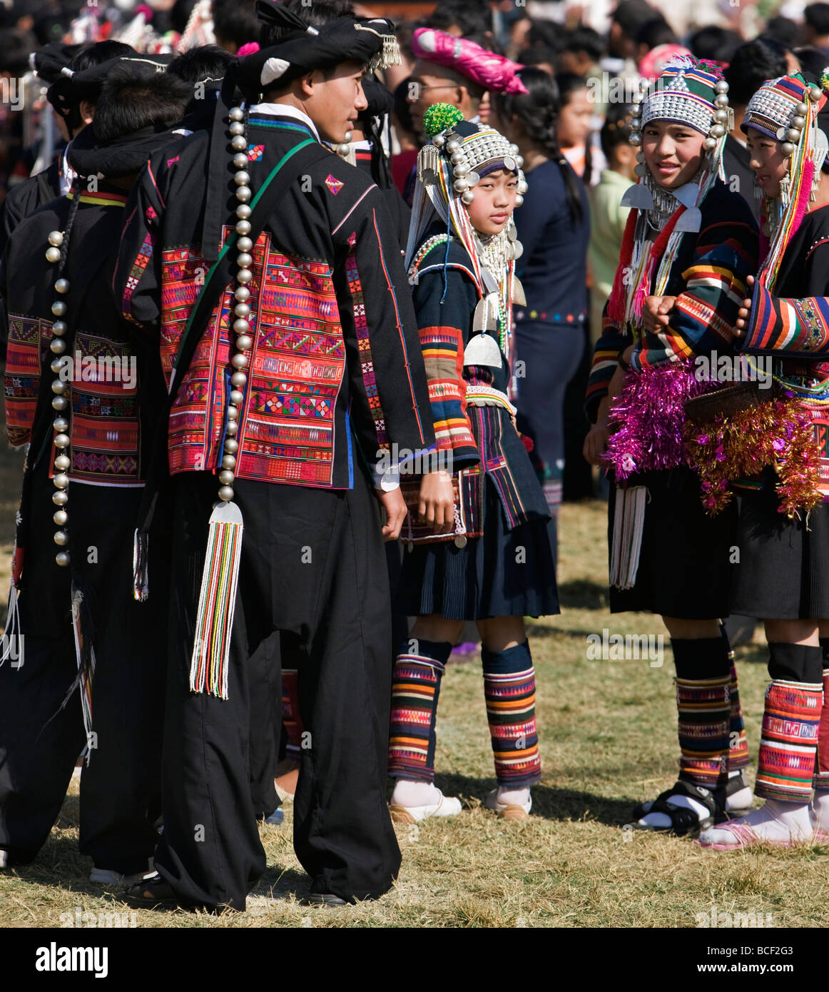 Myanmar, Burma, Kengtung. A gathering of Akha men and women wearing ...