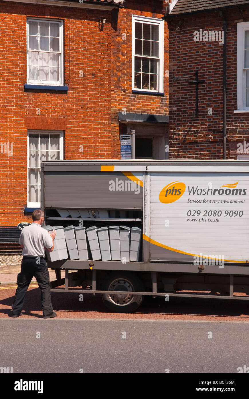 A man at his Phs washrooms van providing washroom services office plant ...