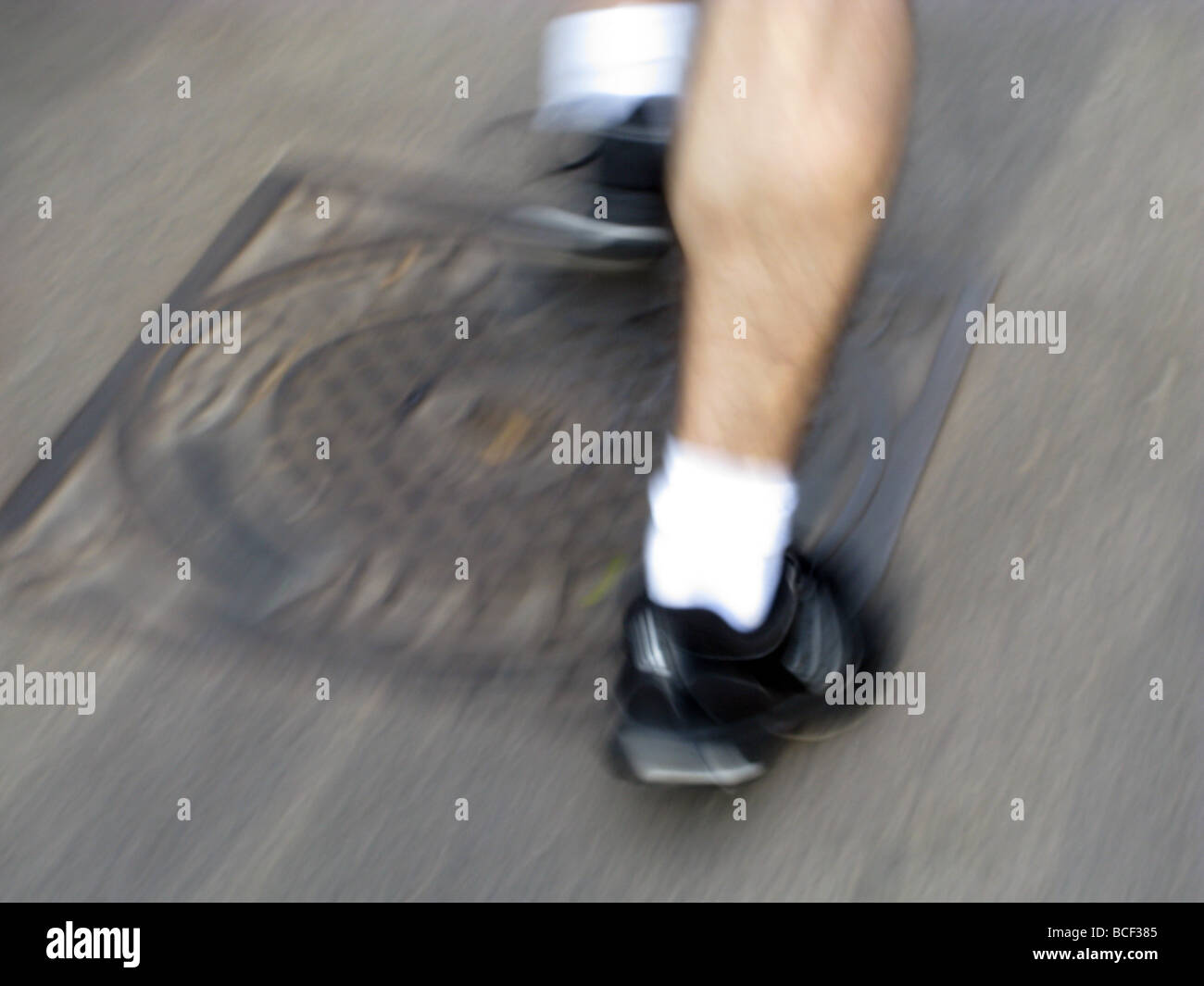 one runner in action on street Stock Photo - Alamy