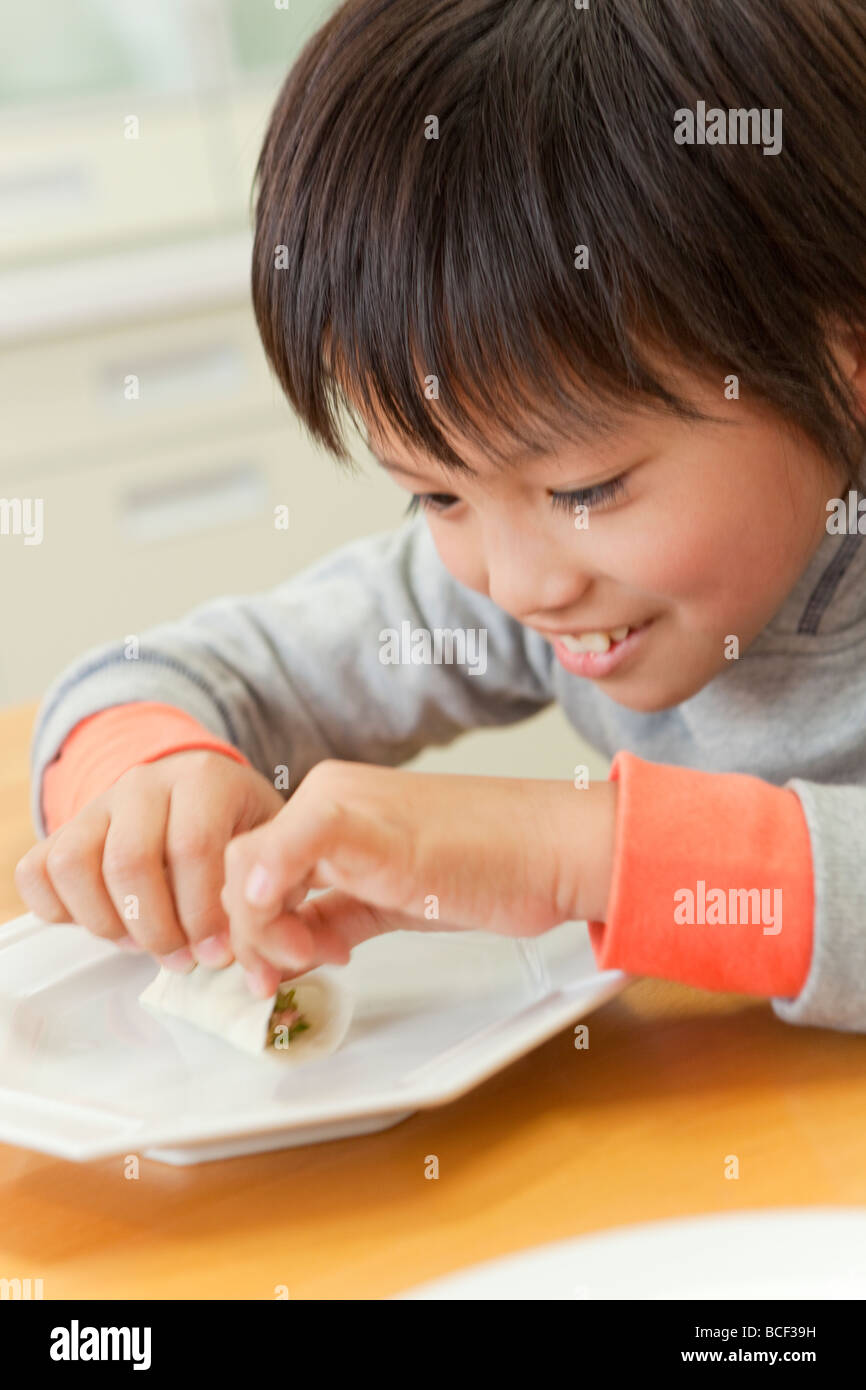 Boy cooking pot-sticker Stock Photo - Alamy