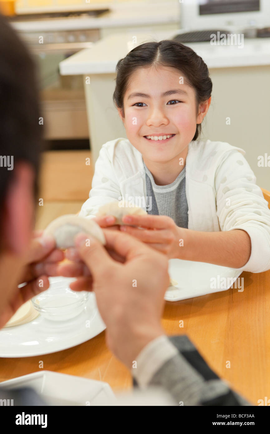 Girl cooking pot-sticker Stock Photo - Alamy