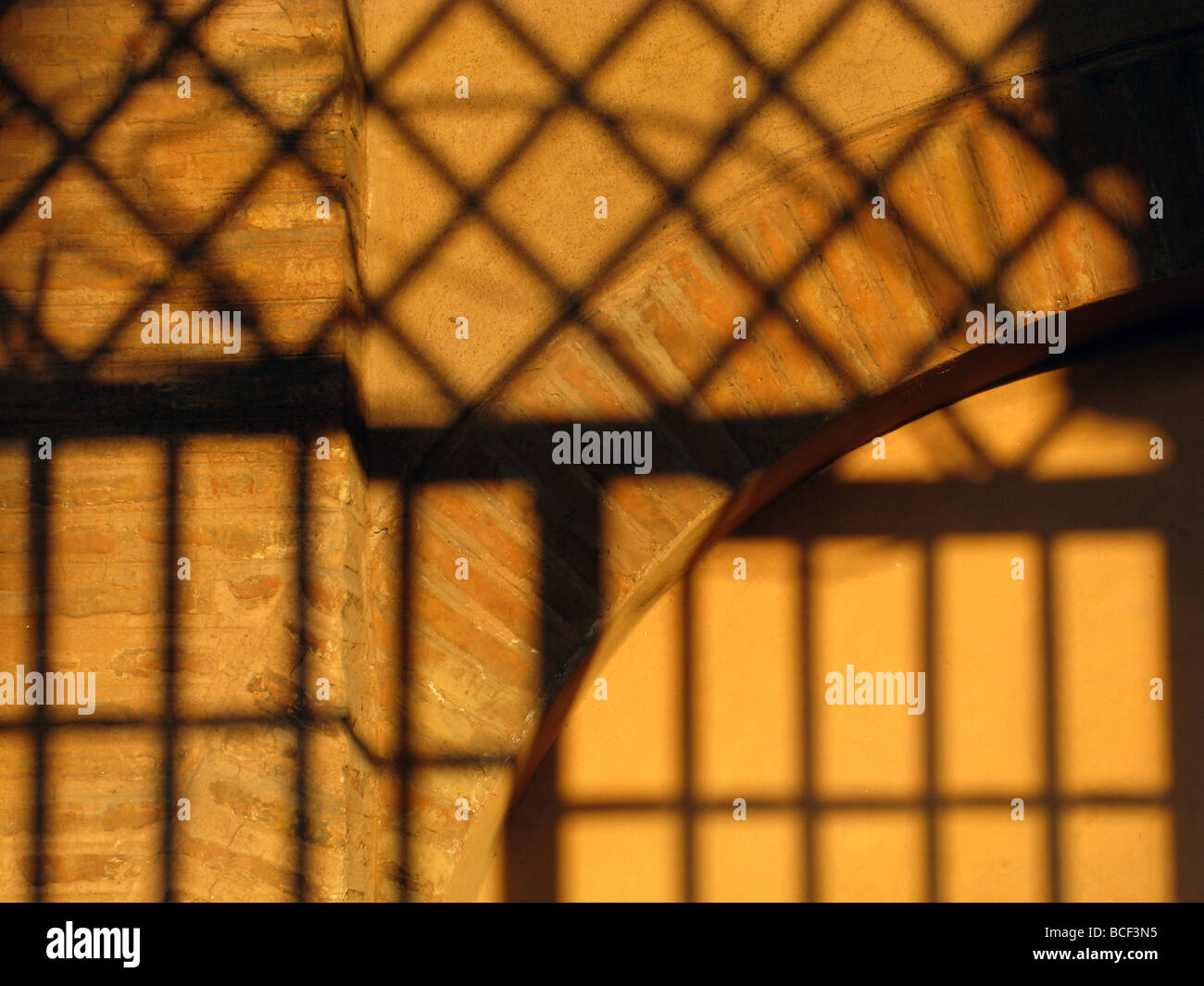 metal bars grill shadow detail on church wall in rome italy Stock Photo ...