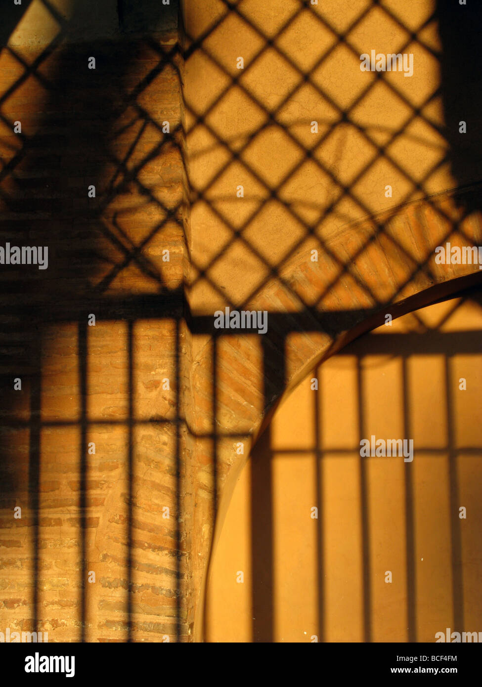 metal bars grill shadow detail on church wall in rome italy Stock Photo ...