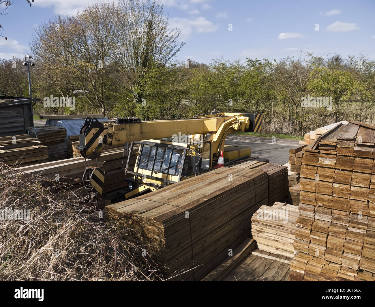 wood and timber in a builders yard Stock Photo - Alamy