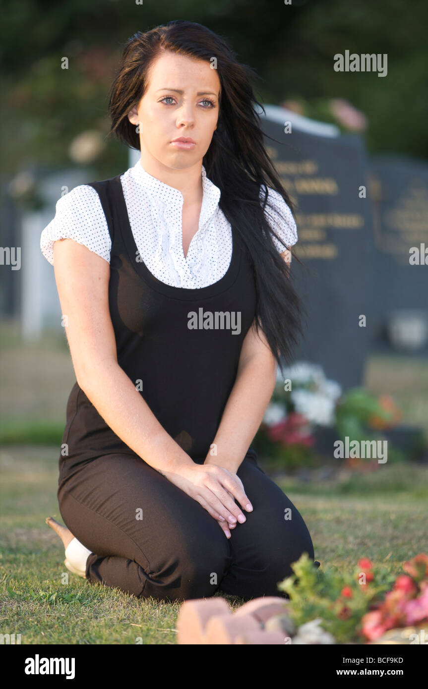 Single person in cemetery Stock Photo - Alamy