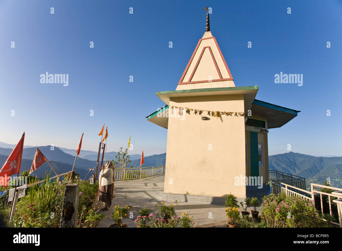 India, Sikkim, Gangtok, Ganesh Tok, Woman praying by prayer flags Stock ...