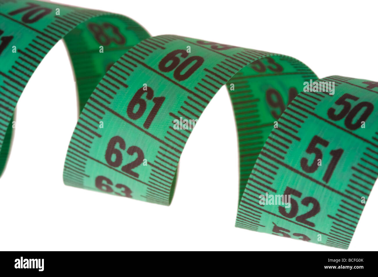 green measuring tape on white background Stock Photo - Alamy