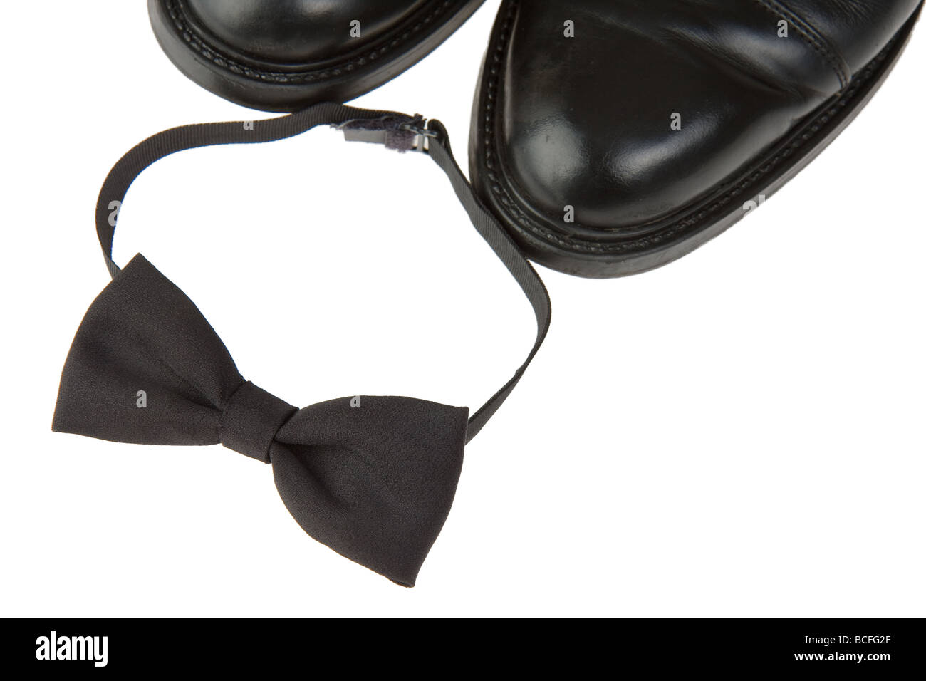 bow tie and black shoes on white background Stock Photo - Alamy