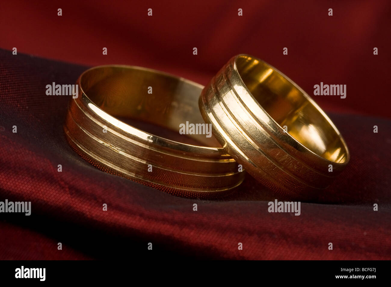 wedding ring on red background Stock Photo - Alamy