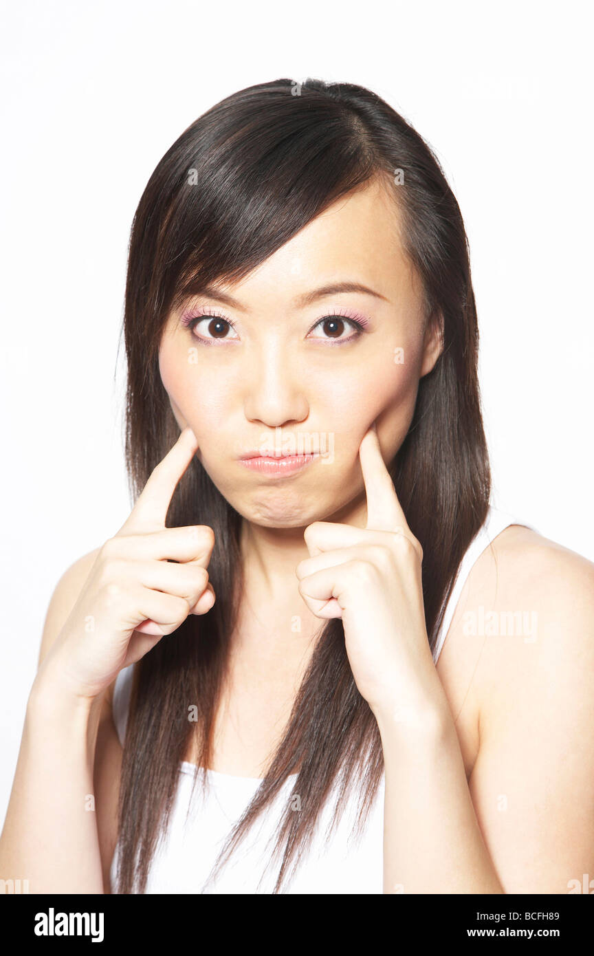 woman finger on the chin Stock Photo - Alamy