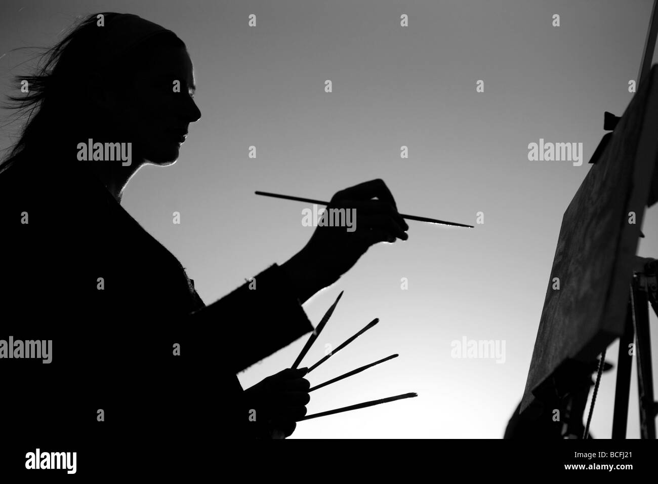 artist at work holding pencils Stock Photo - Alamy